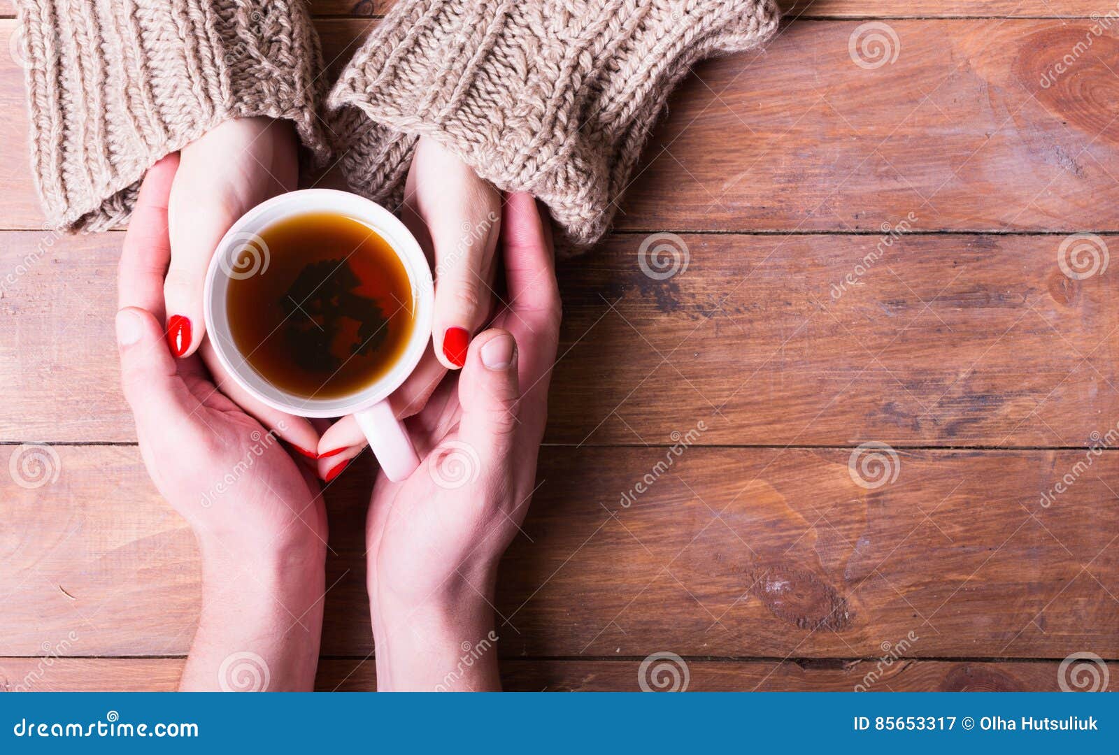 Tea in woman hand stock image. Image of table, sweater - 85653317