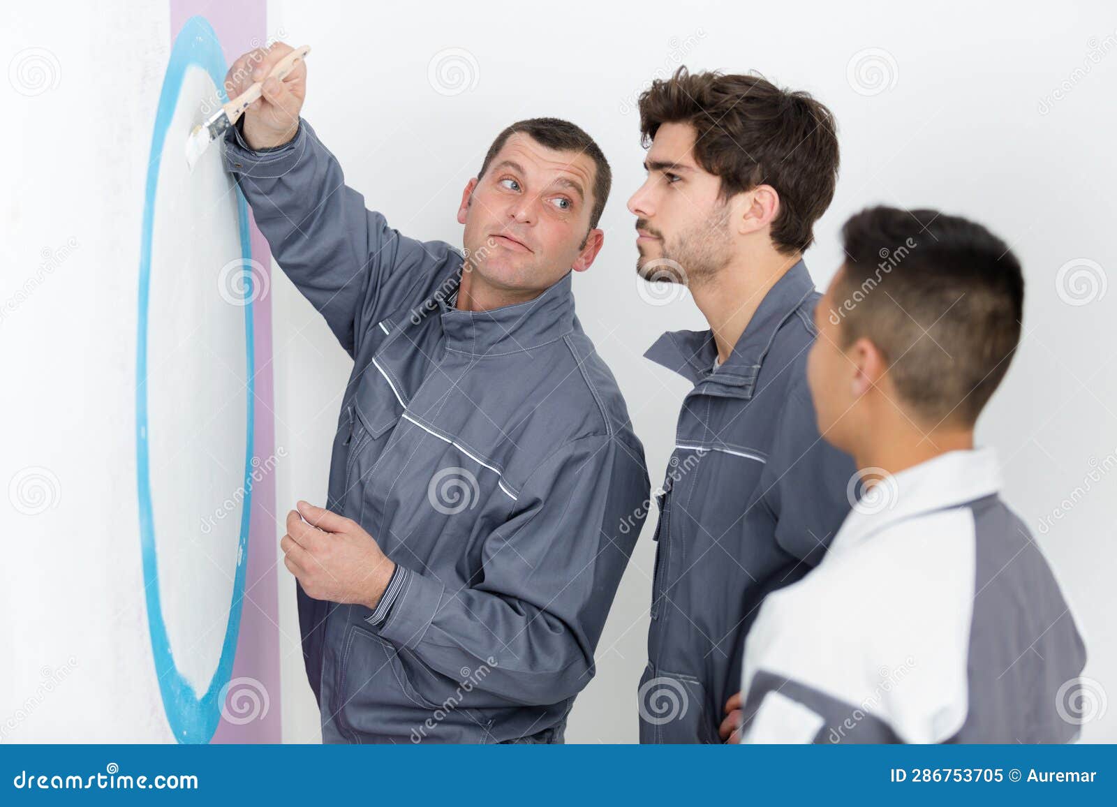 Teacher and Apprentice Working on Wall Stock Image - Image of wall ...