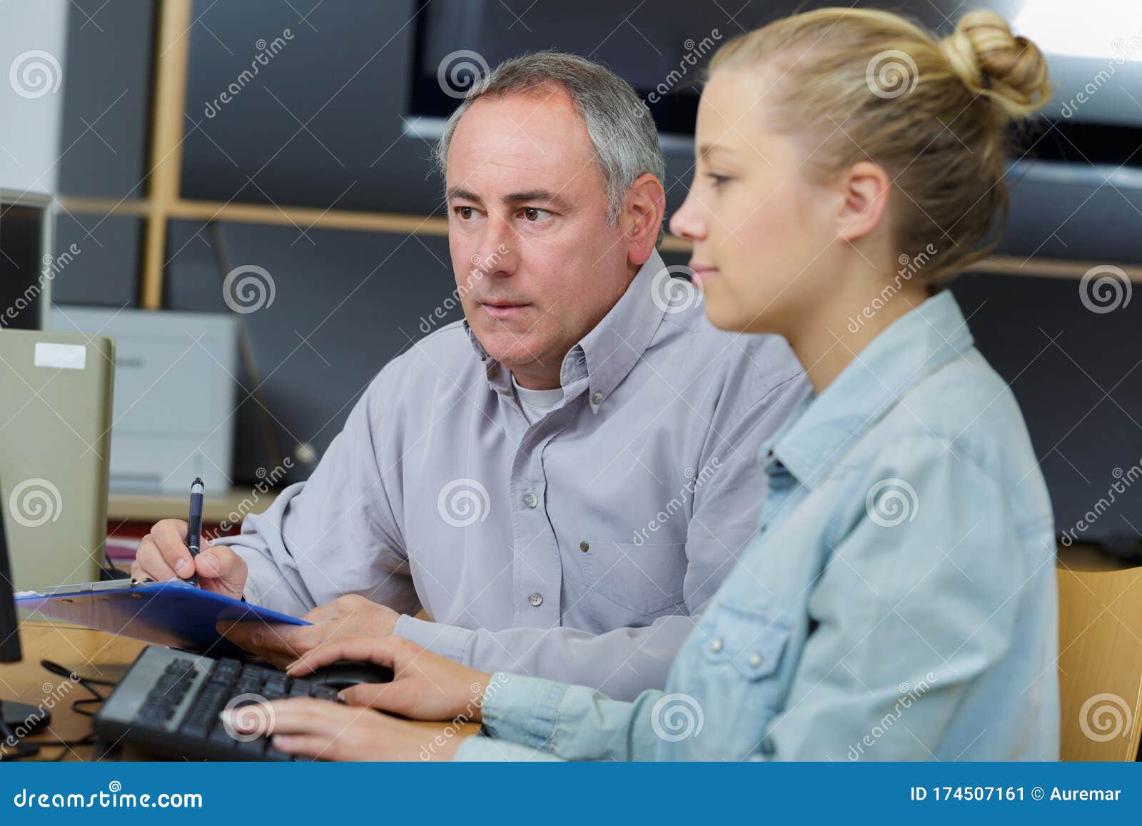 Teacher Assessing Student Using Computer Stock Image - Image of ...