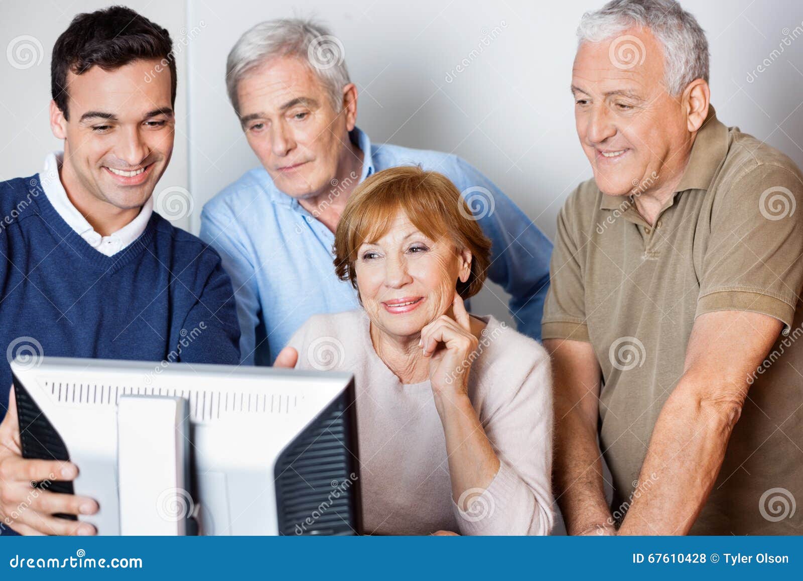 Teacher Assisting Senior People in Using Computer at Class Stock Photo ...