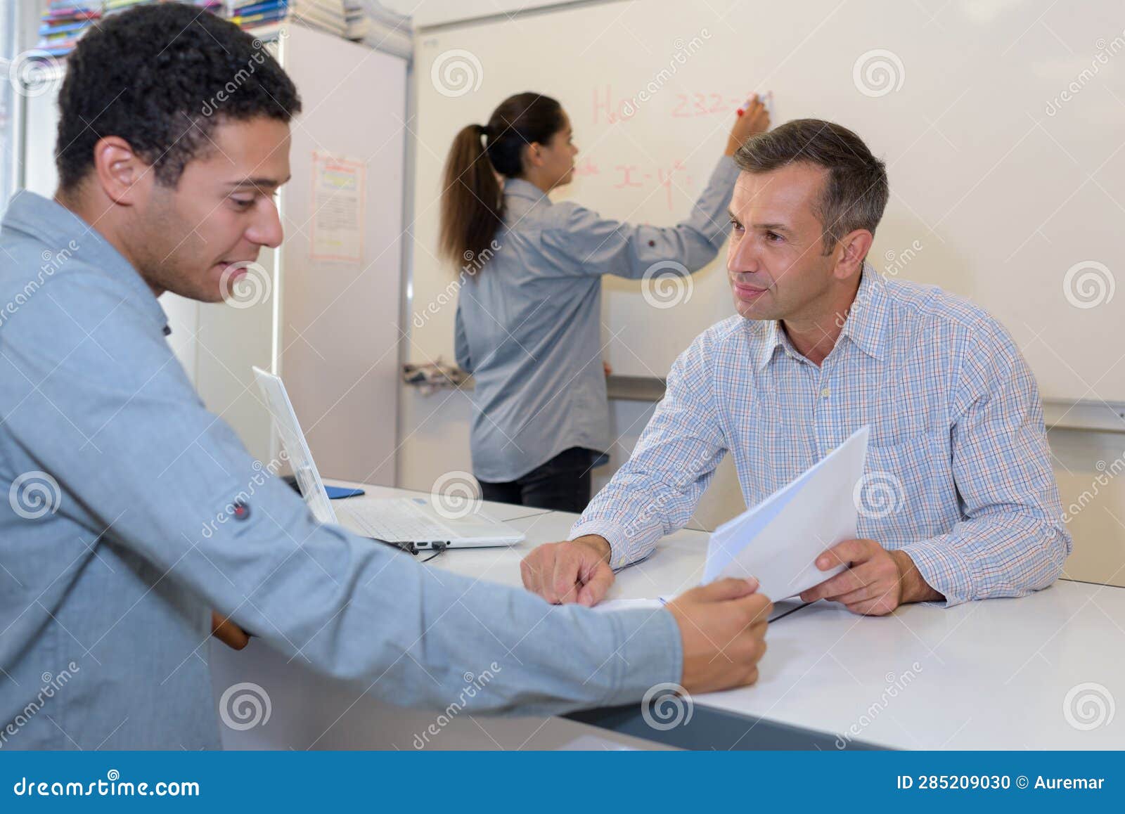 Teacher Awaiting Answer from Male Student Stock Photo - Image of ...
