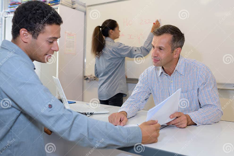 Teacher Awaiting Answer from Male Student Stock Photo - Image of ...