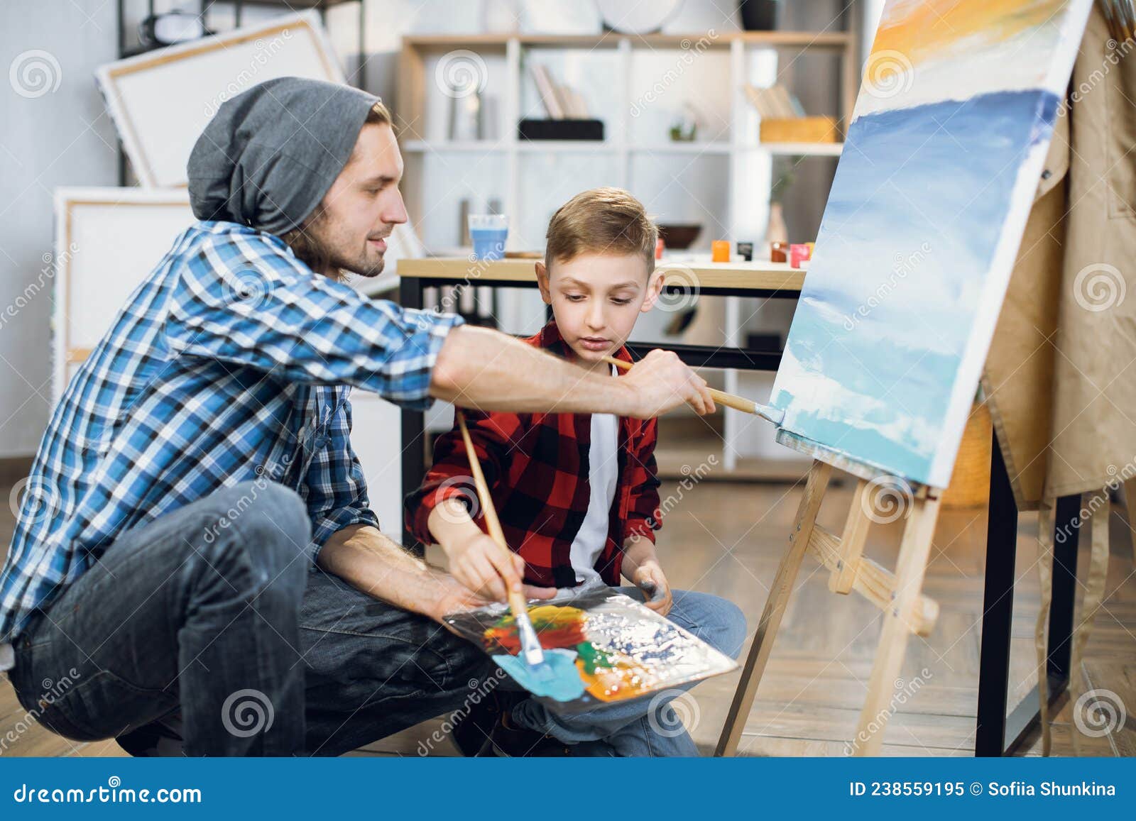 Teacher and Boy Using Brushes and Palette for Drawing Stock Image ...