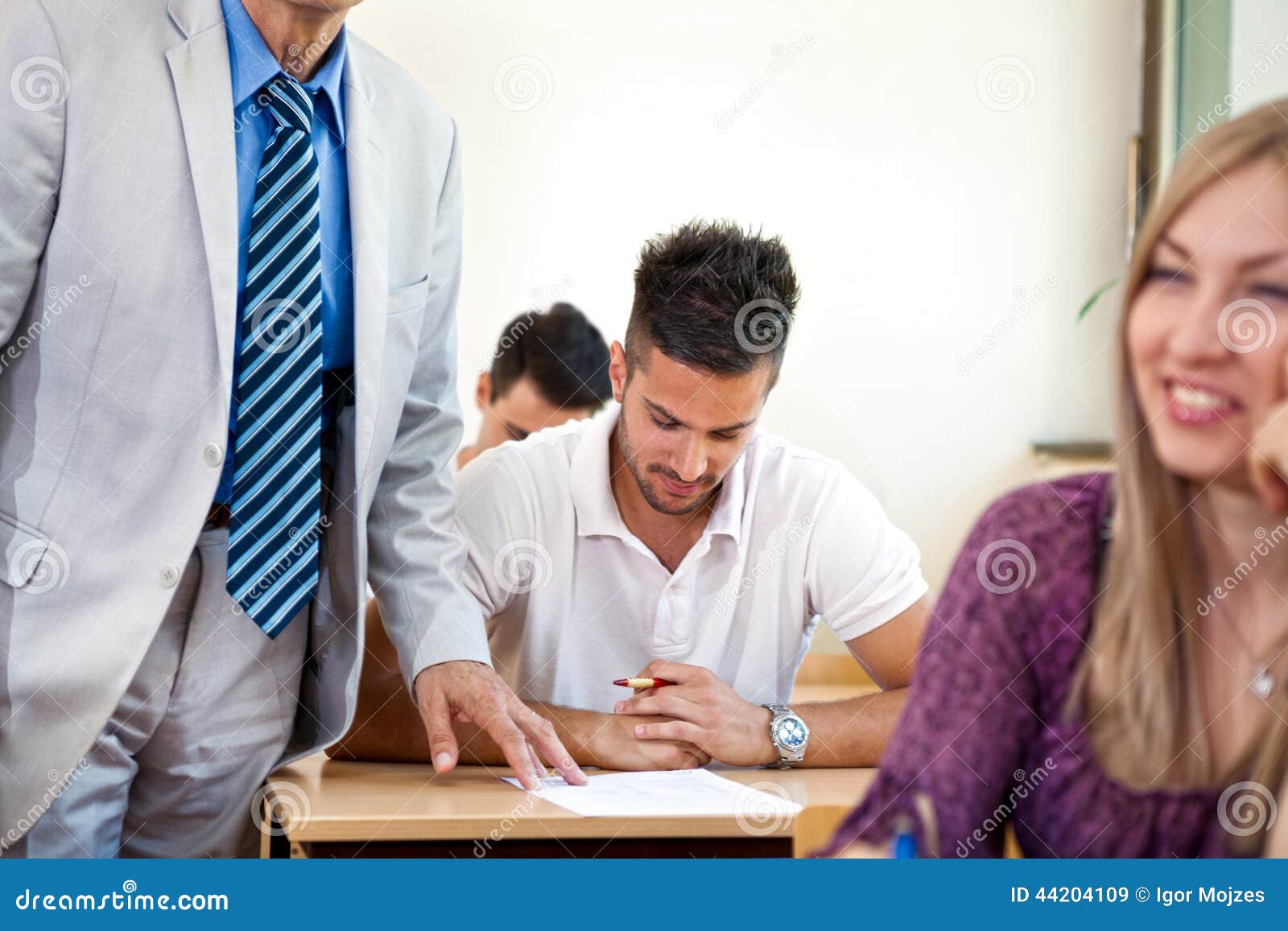 Teacher Checking Student Work Stock Image - Image of cooperation, girl ...