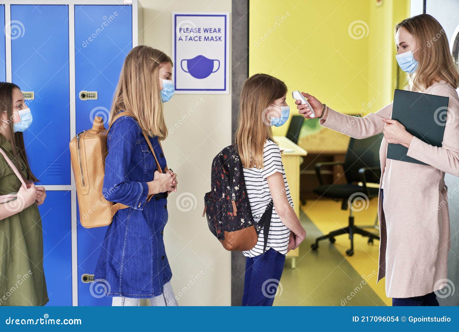 Checking the Temperature of the Students before Entering the Classroom ...