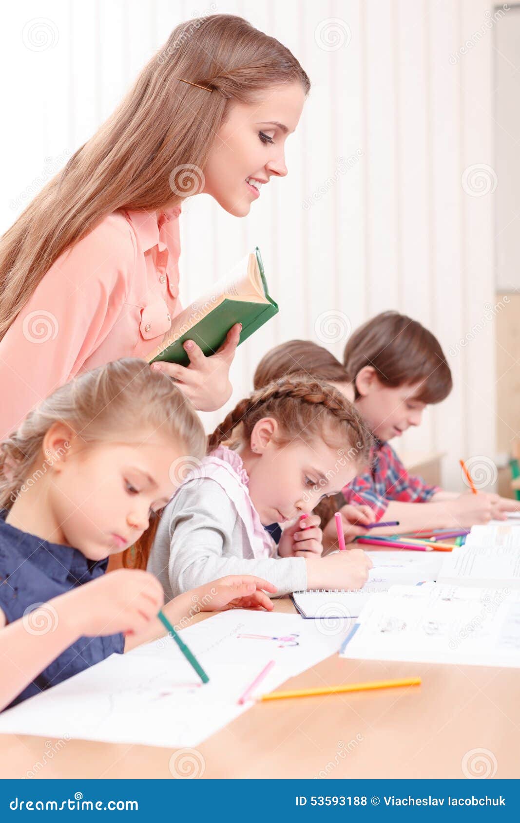 Teacher Checking Work of Pupils Stock Photo - Image of lifestyle, pupil ...