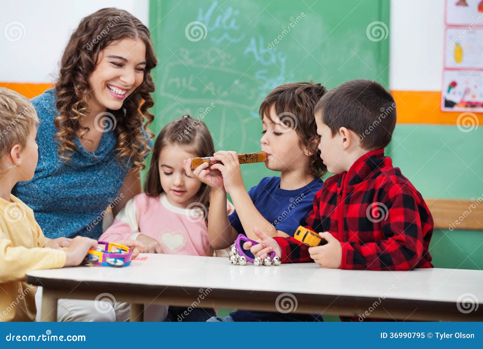 Teacher with Children Playing Musical Instruments Stock Image - Image ...