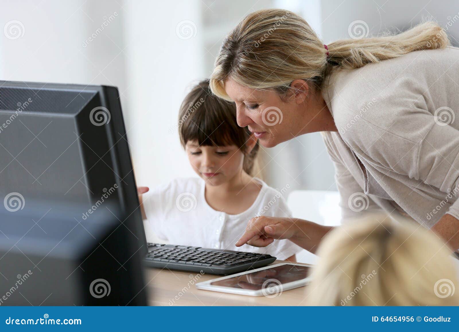 Teacher with Children at School Using Computer Stock Photo - Image of ...