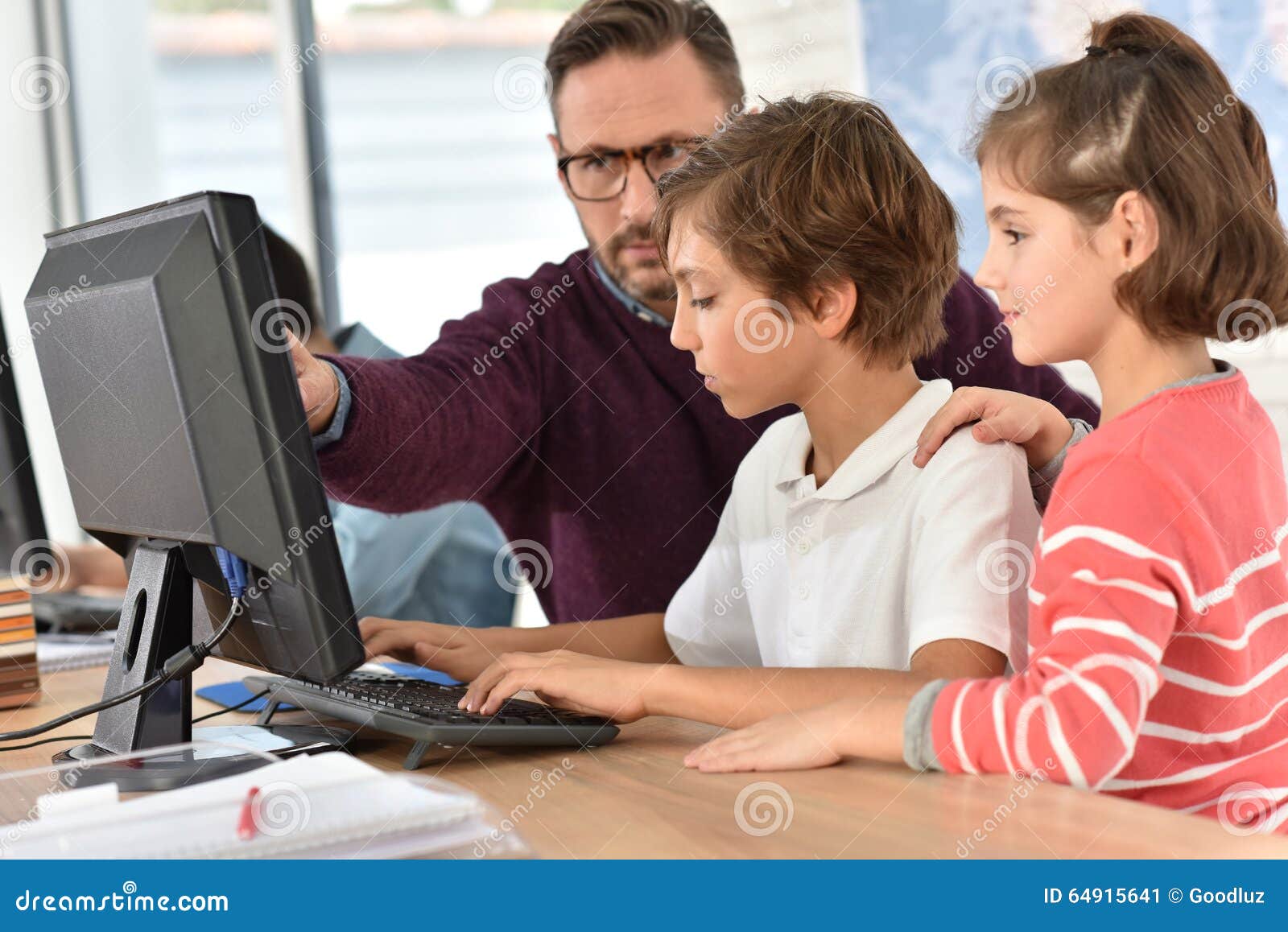 Teacher with Children Working on Computer Stock Image - Image of ...