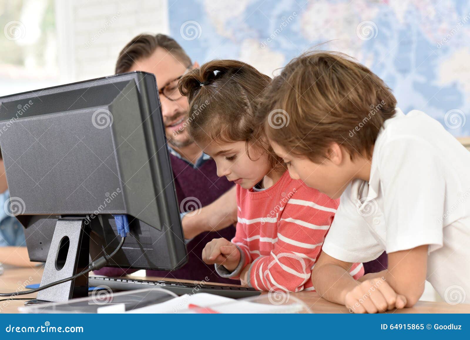 Teacher with Children Working on Computer Stock Image - Image of ...