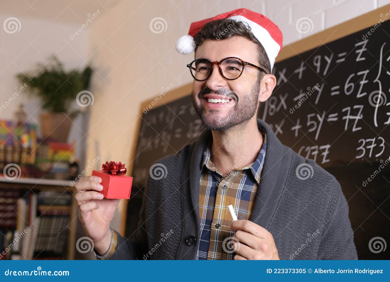 Teacher during Christmas with Santa Claus Hat Stock Image - Image of ...