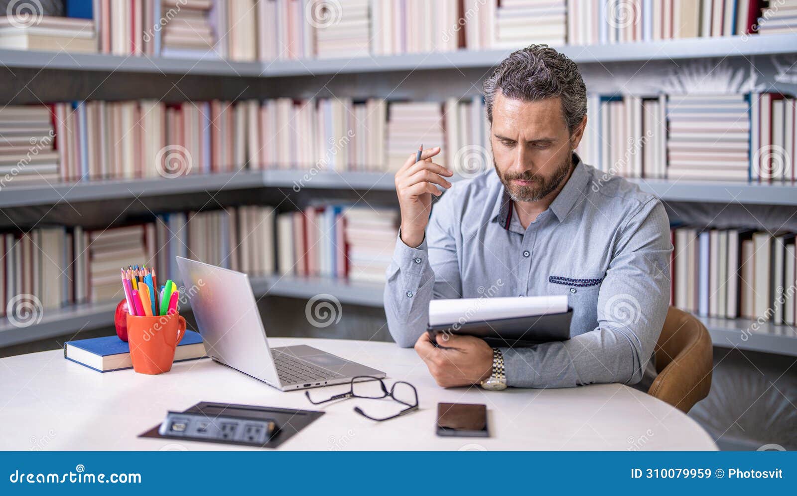 Teacher in Classroom. Man Teacher Study at Workplace. Teachers from ...