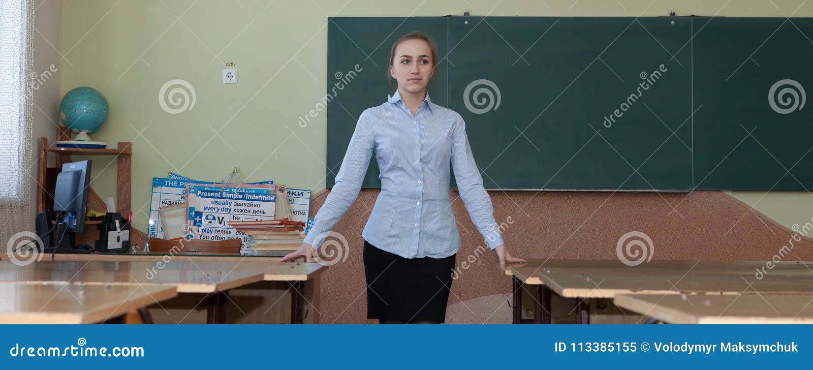 Teacher in Classroom Near Desks Stock Image - Image of resting ...