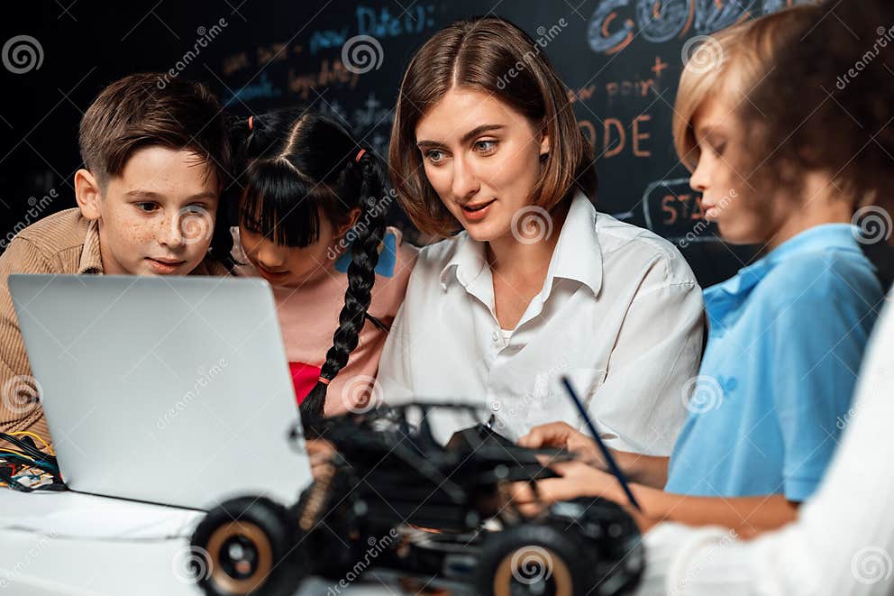 Teacher Demonstrate Attentive Children To Code Robots in STEM Class ...