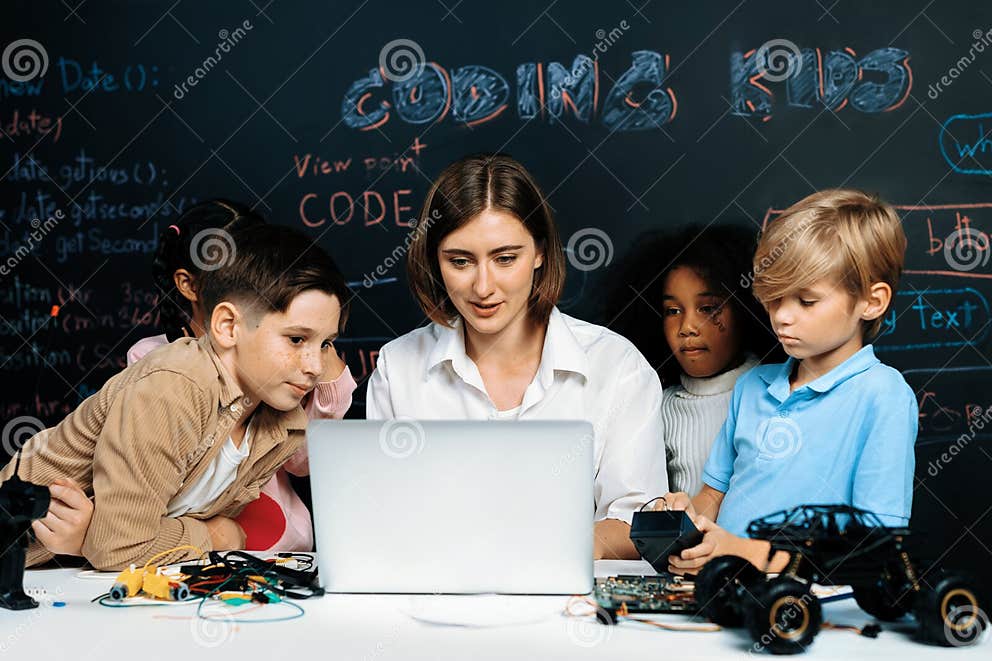 Teacher Demonstrate Attentive Children To Code Robots in STEM Class. Erudition. Stock Photo ...