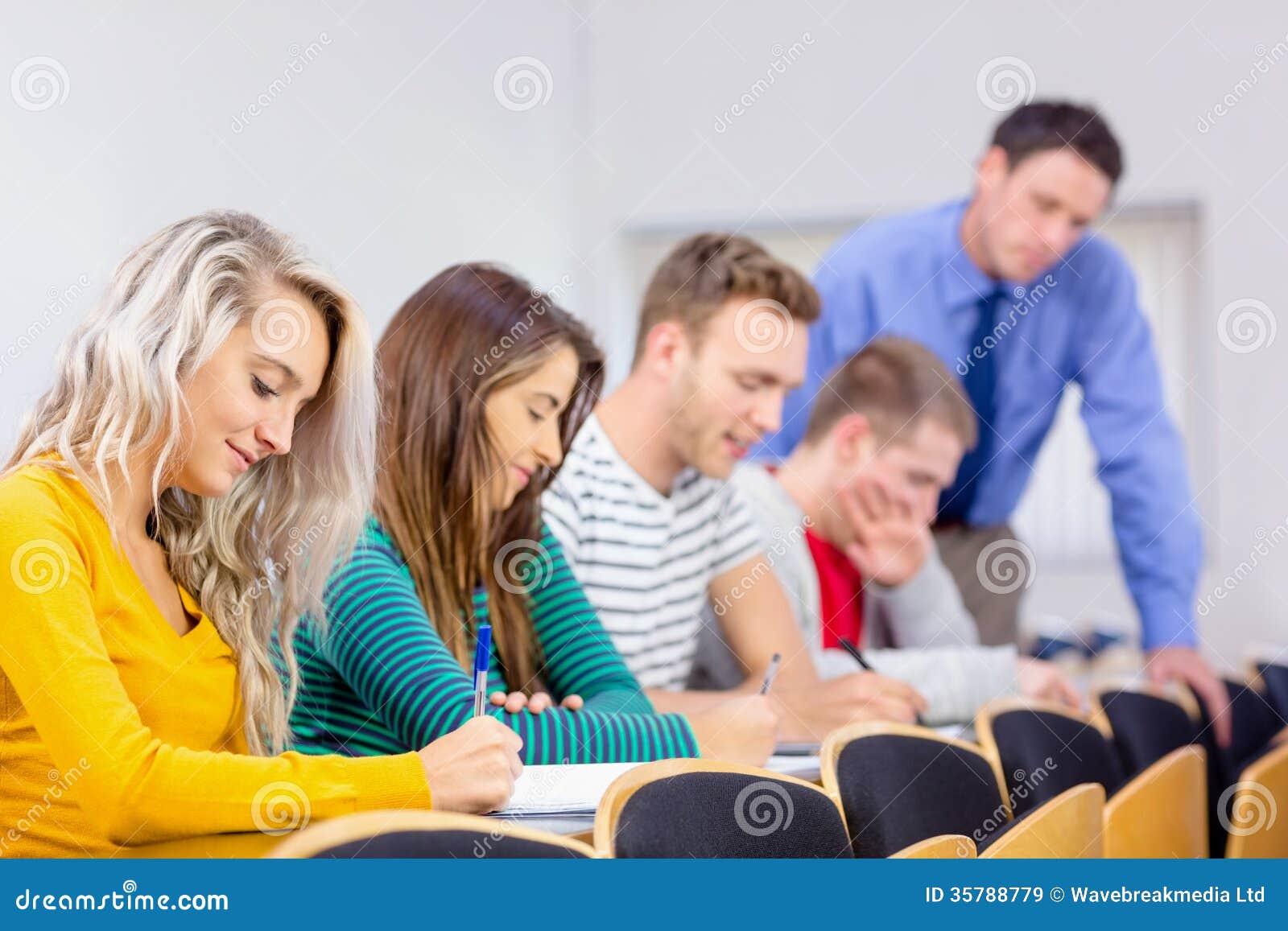 Teacher with College Students in the Classroom Stock Image - Image of ...