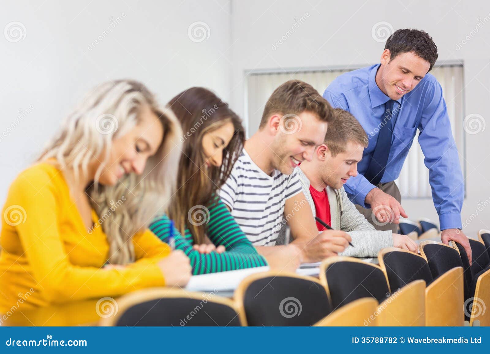 Teacher with College Students at the Classroom Stock Photo - Image of ...