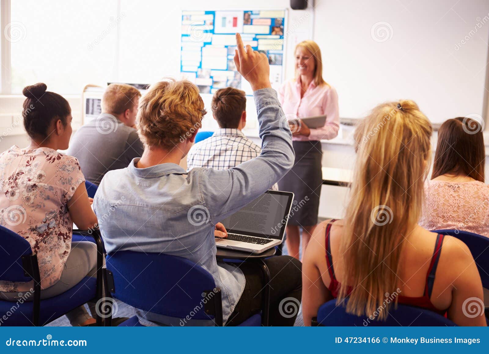 Teacher with College Students Giving Lesson in Classroom Stock Photo ...