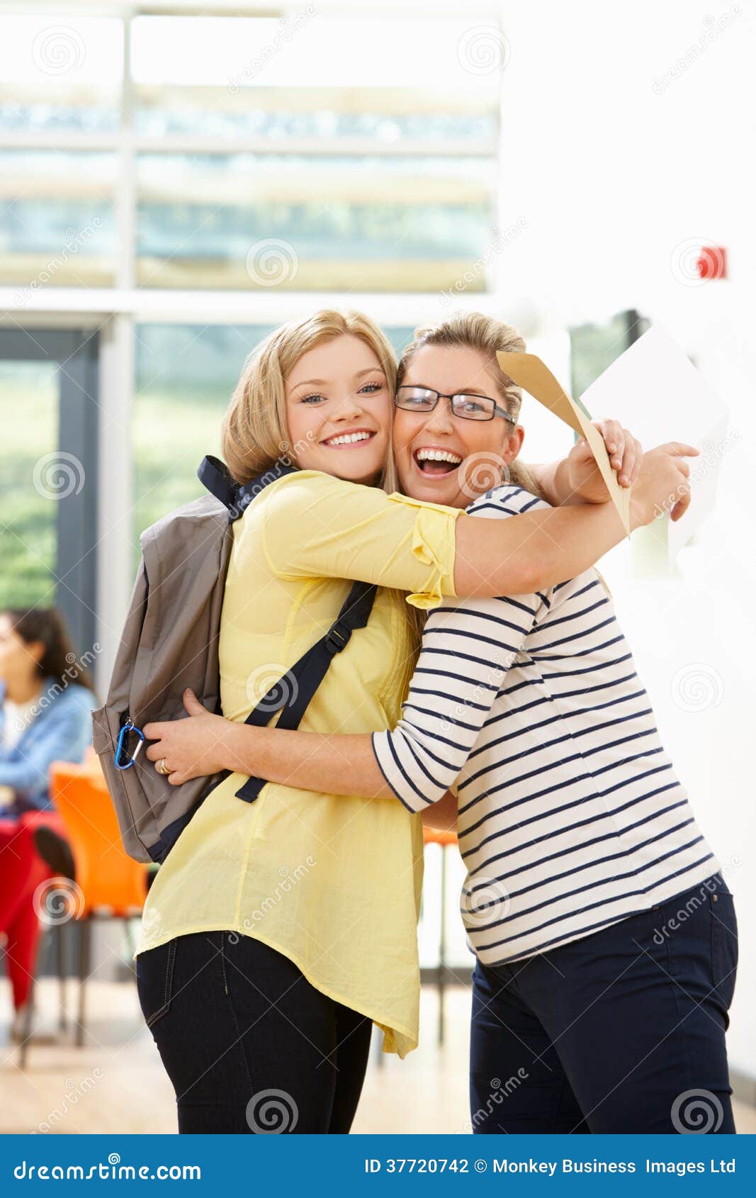 Teacher Congratulating Pupil on Successful Exam Result Stock Photo ...