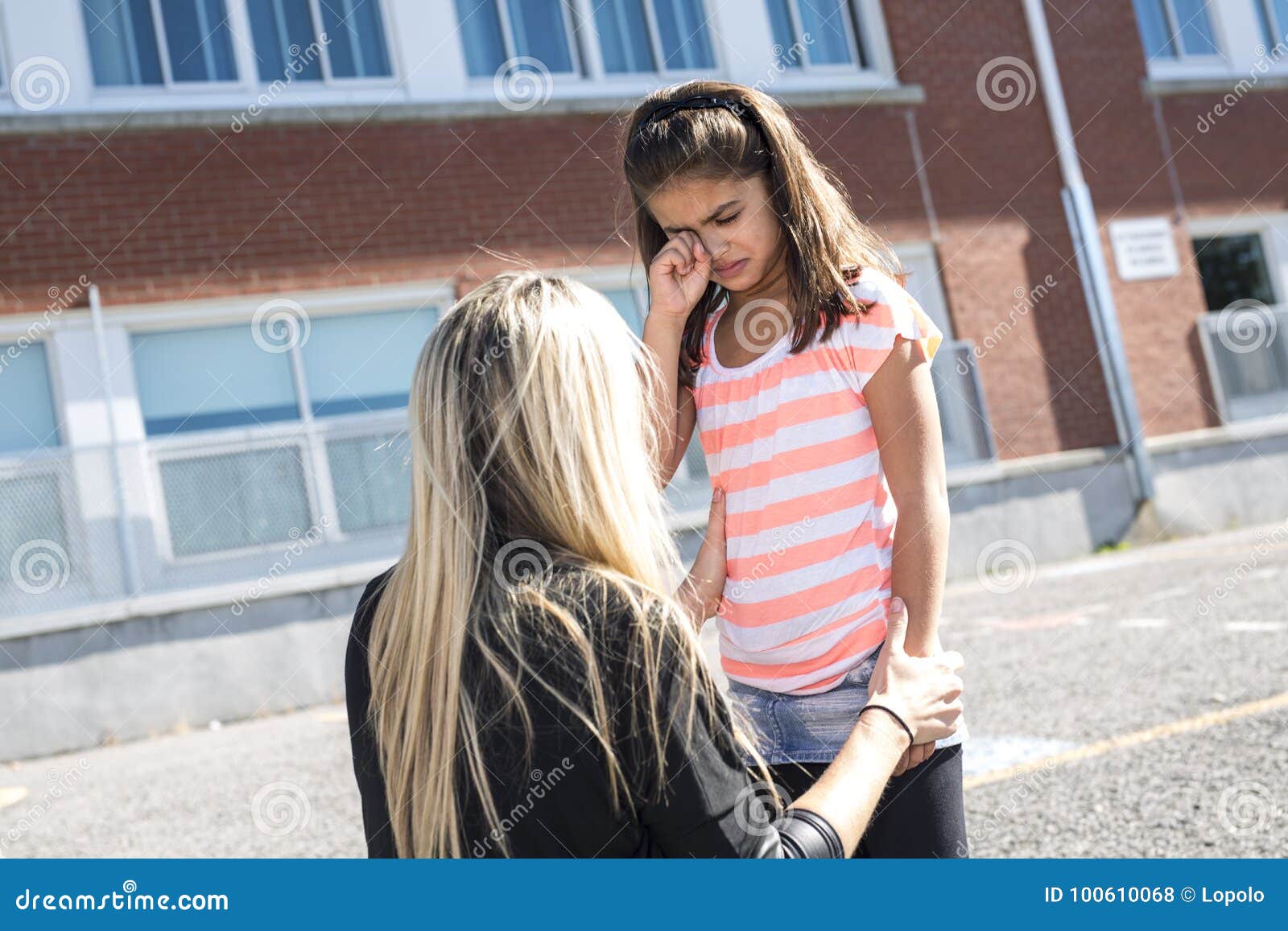 Teacher Consoling a Girl on Schoolyards Stock Photo - Image of outside ...