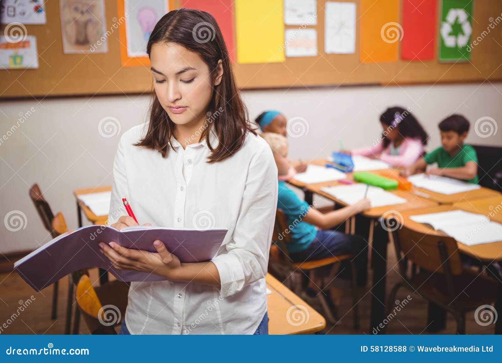 Teacher Correcting Some Class Work Stock Photo - Image of education ...