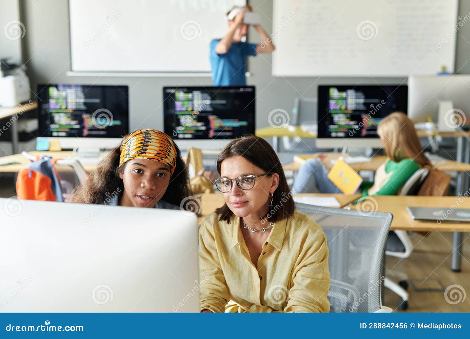 Teacher Working with Students at Lesson Stock Photo - Image of computer ...