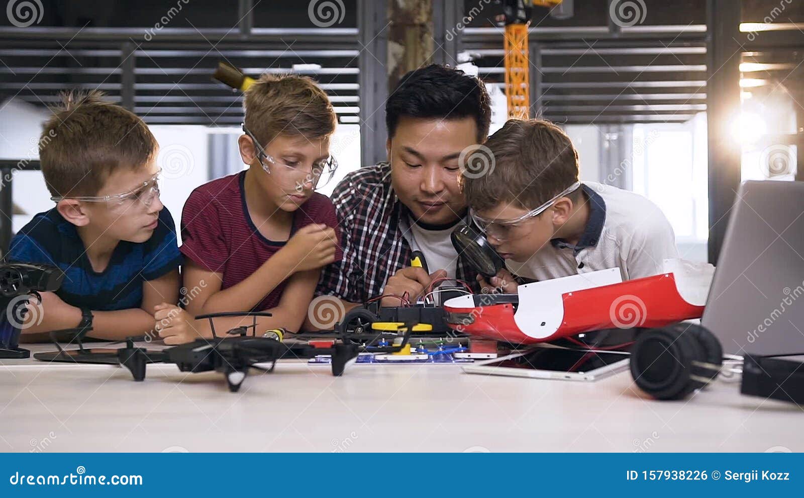 Teacher of Electronic Engineer Together with Caucasian Students Working ...