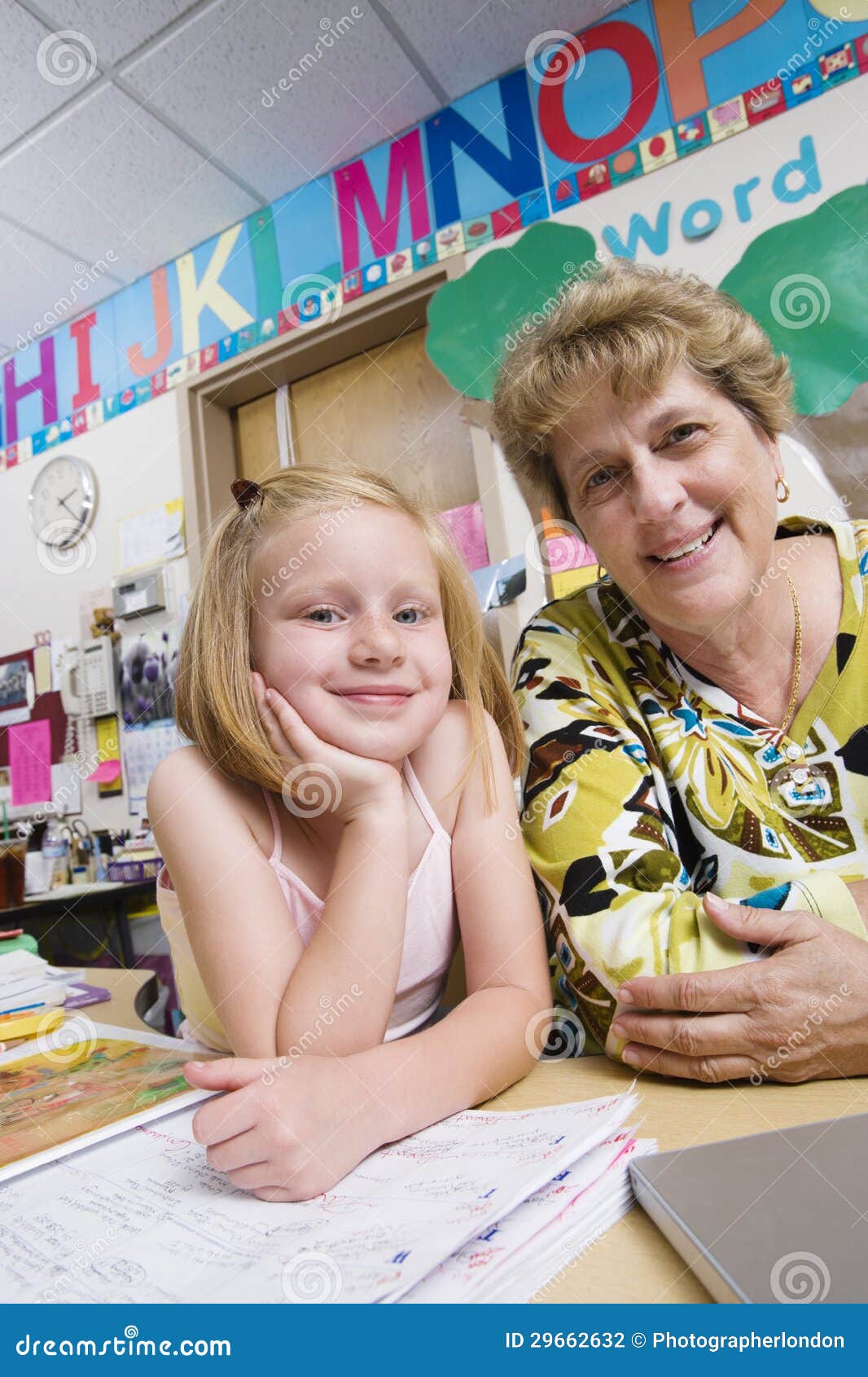 Teacher with Elementary Student Stock Photo - Image of indoors ...