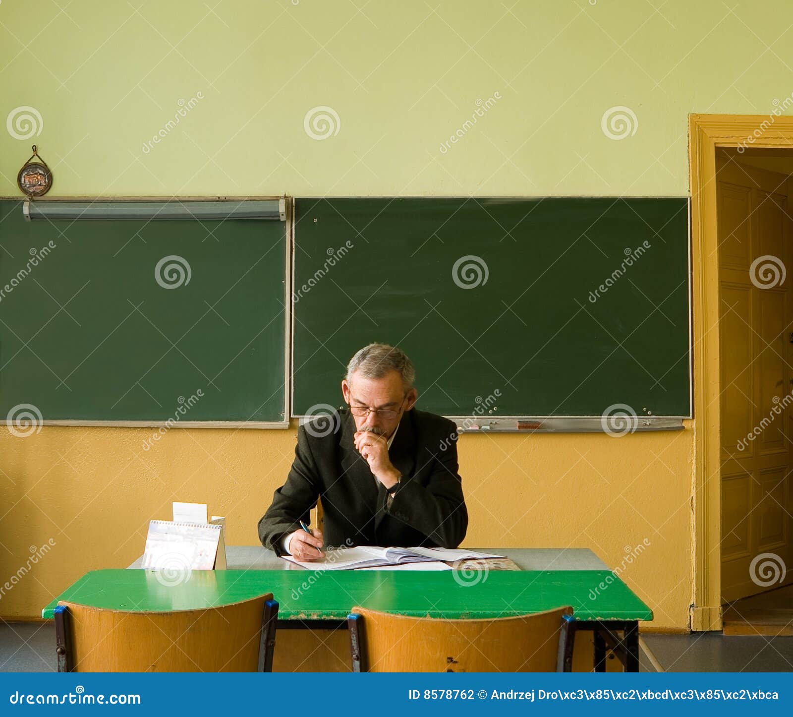 Teacher in empty classroom stock photo. Image of door - 8578762