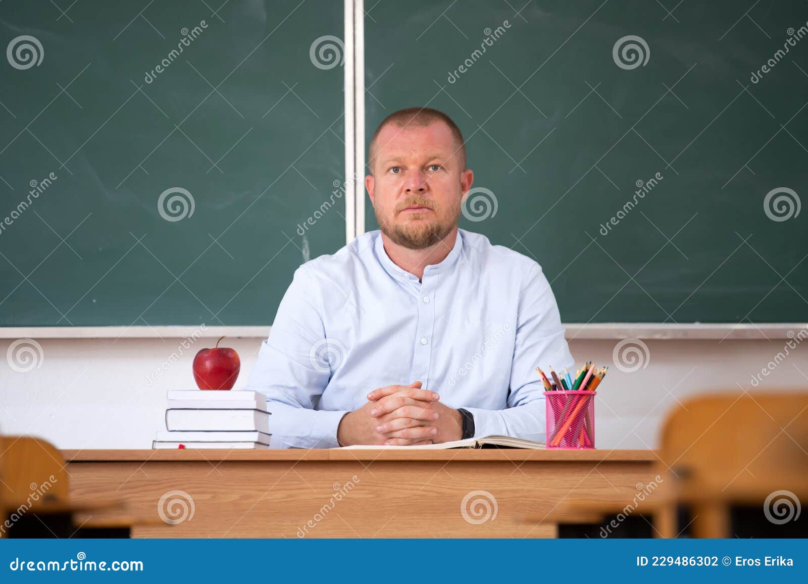 Teacher in empty classroom stock photo. Image of learning - 229486302