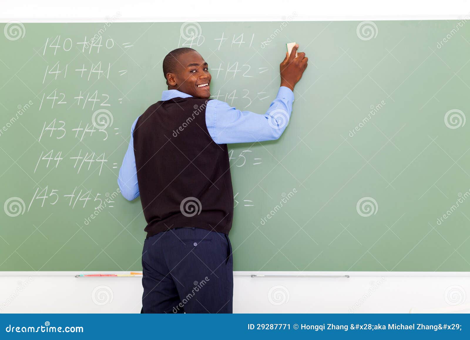 Teacher erasing chalkboard stock image. Image of adult - 29287771