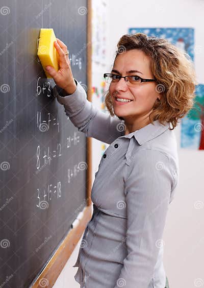 Teacher Erasing Chalkboard with Sponge Stock Image - Image of room ...