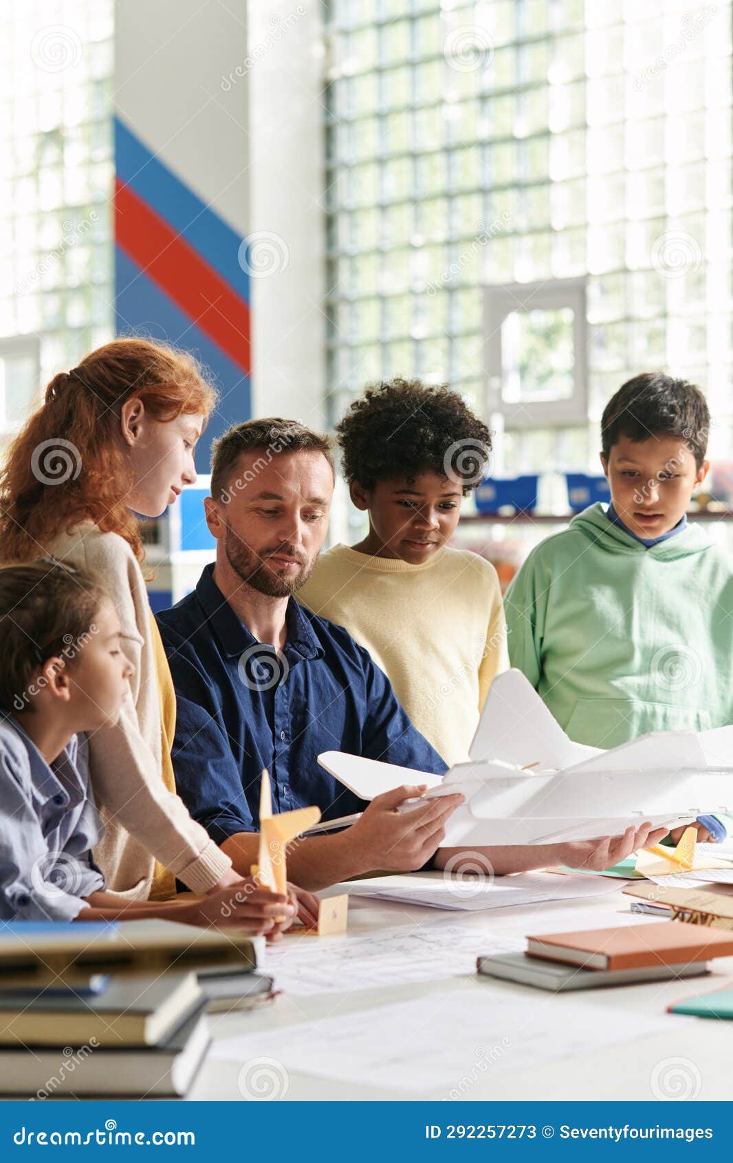 Teacher Examining Plane Model Stock Image - Image of table, diversity ...