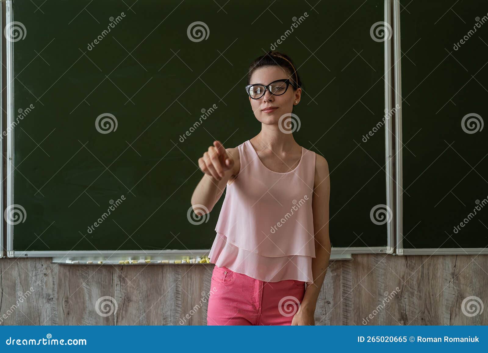 Teacher Explain New Lesson Near the Empty School Blackboard, Copy Space ...