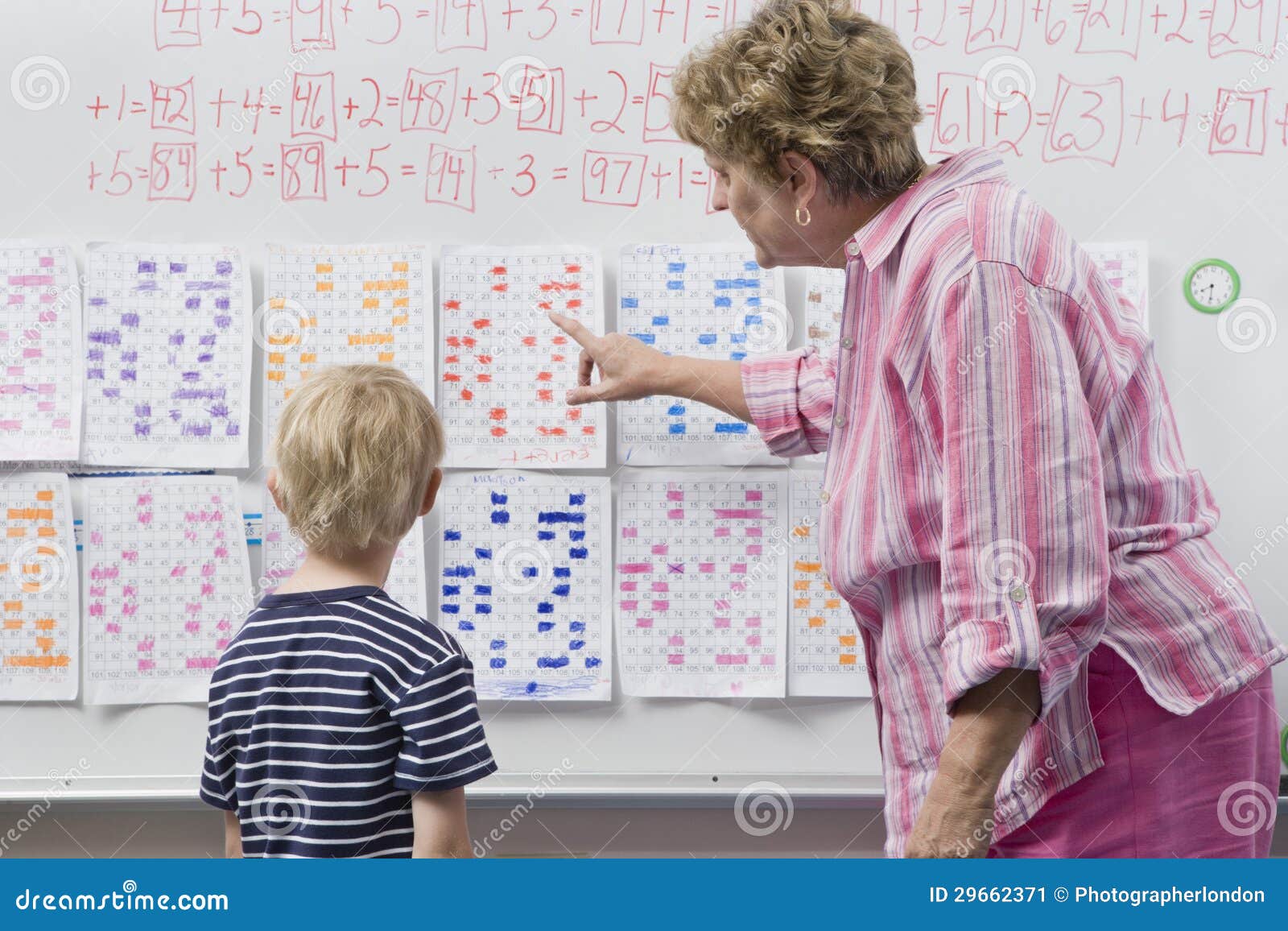 Teacher Explaining Calendar To Little Boy Stock Image - Image of ...