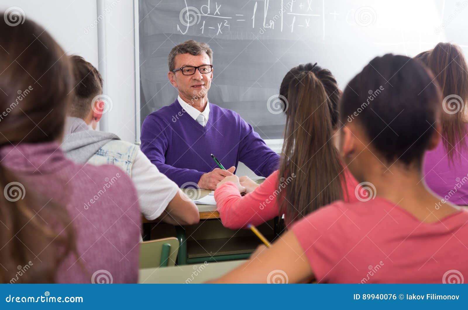 Teacher Explaining the Math Near Chalkboard Stock Photo - Image of ...