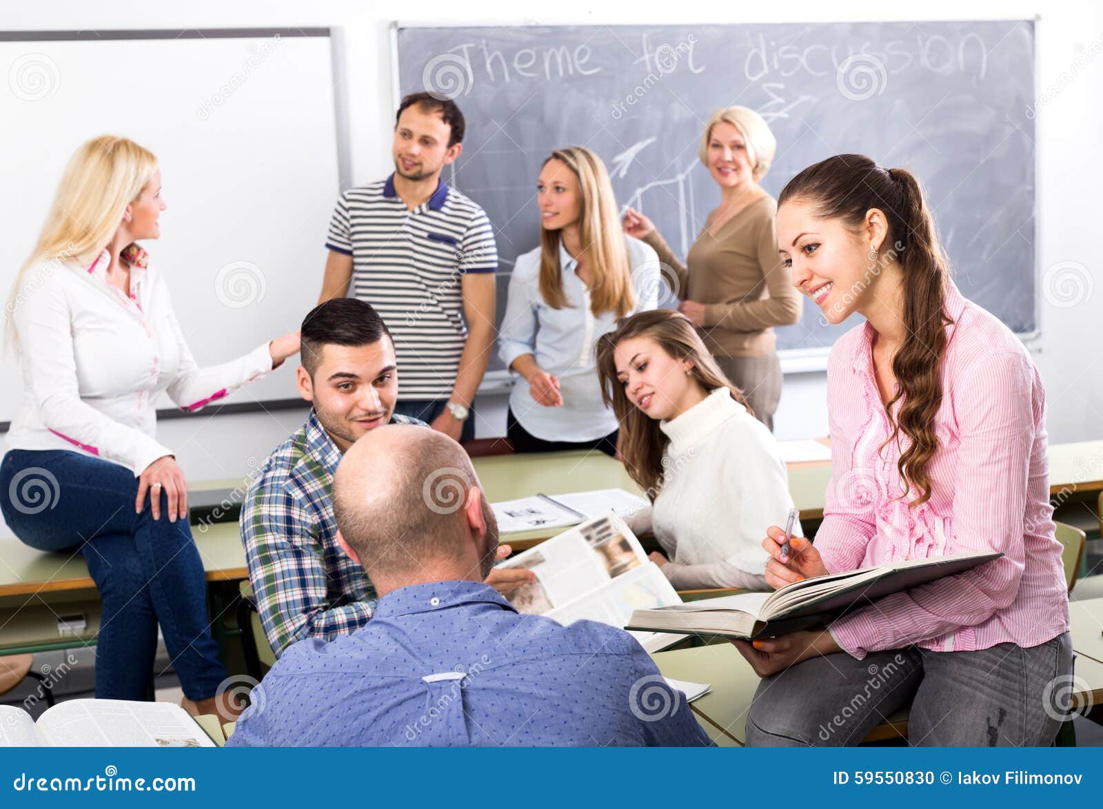 Teacher Explaining Something during a Break Stock Photo - Image of ...