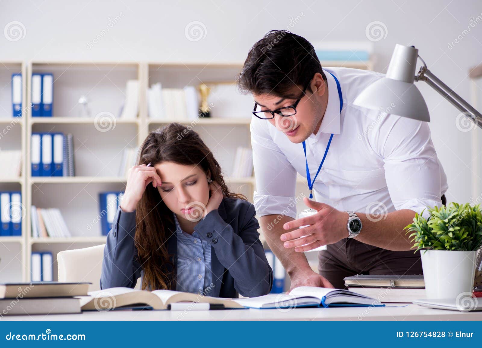 The Teacher Explaining To Student at Lecture Stock Photo - Image of ...