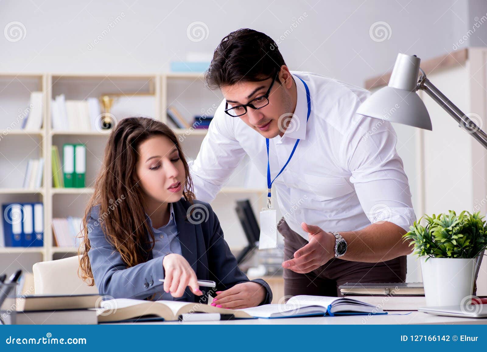 The Teacher Explaining To Student at Lecture Stock Photo - Image of ...