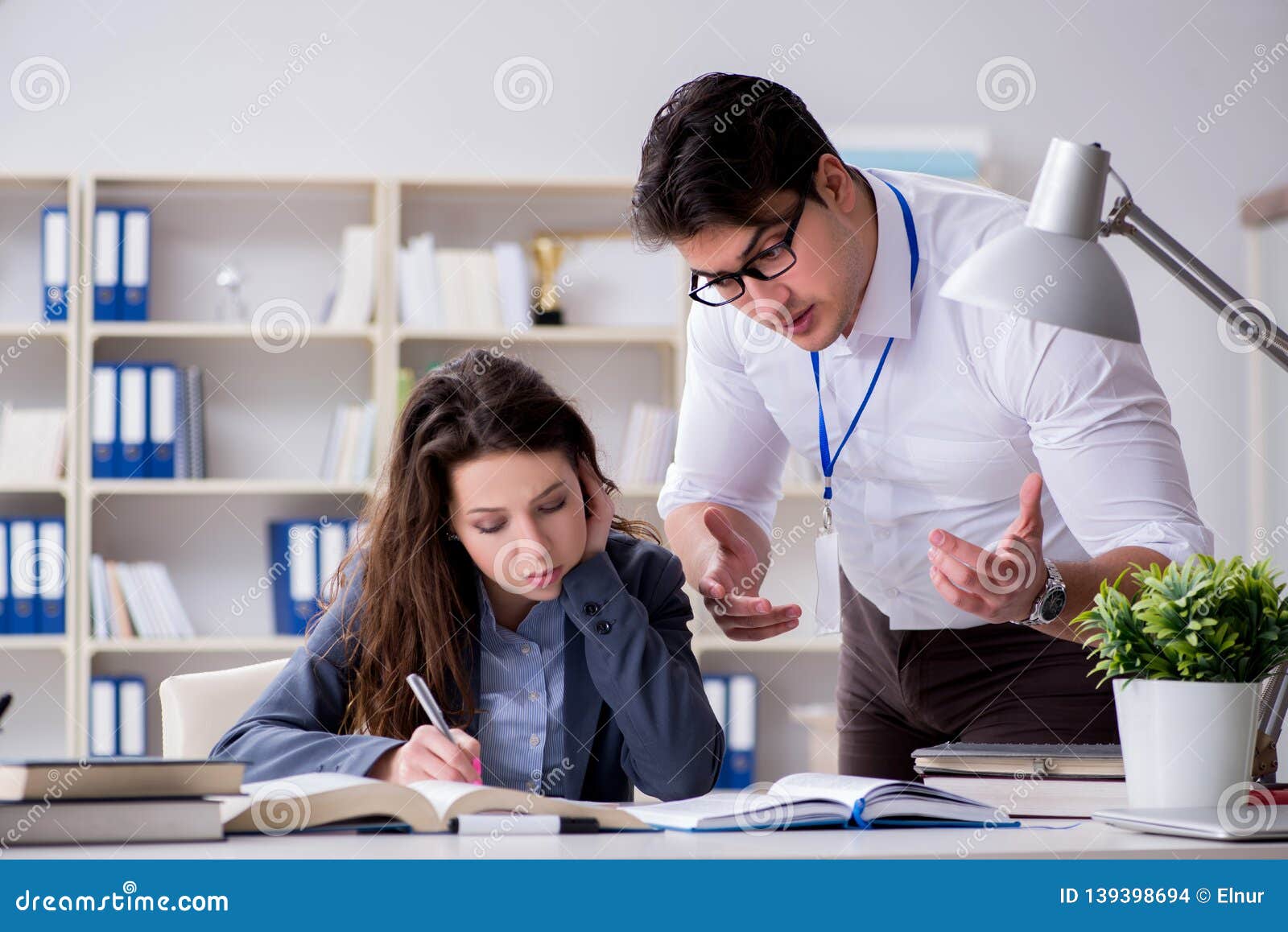 The Teacher Explaining To Student at Lecture Stock Photo - Image of ...