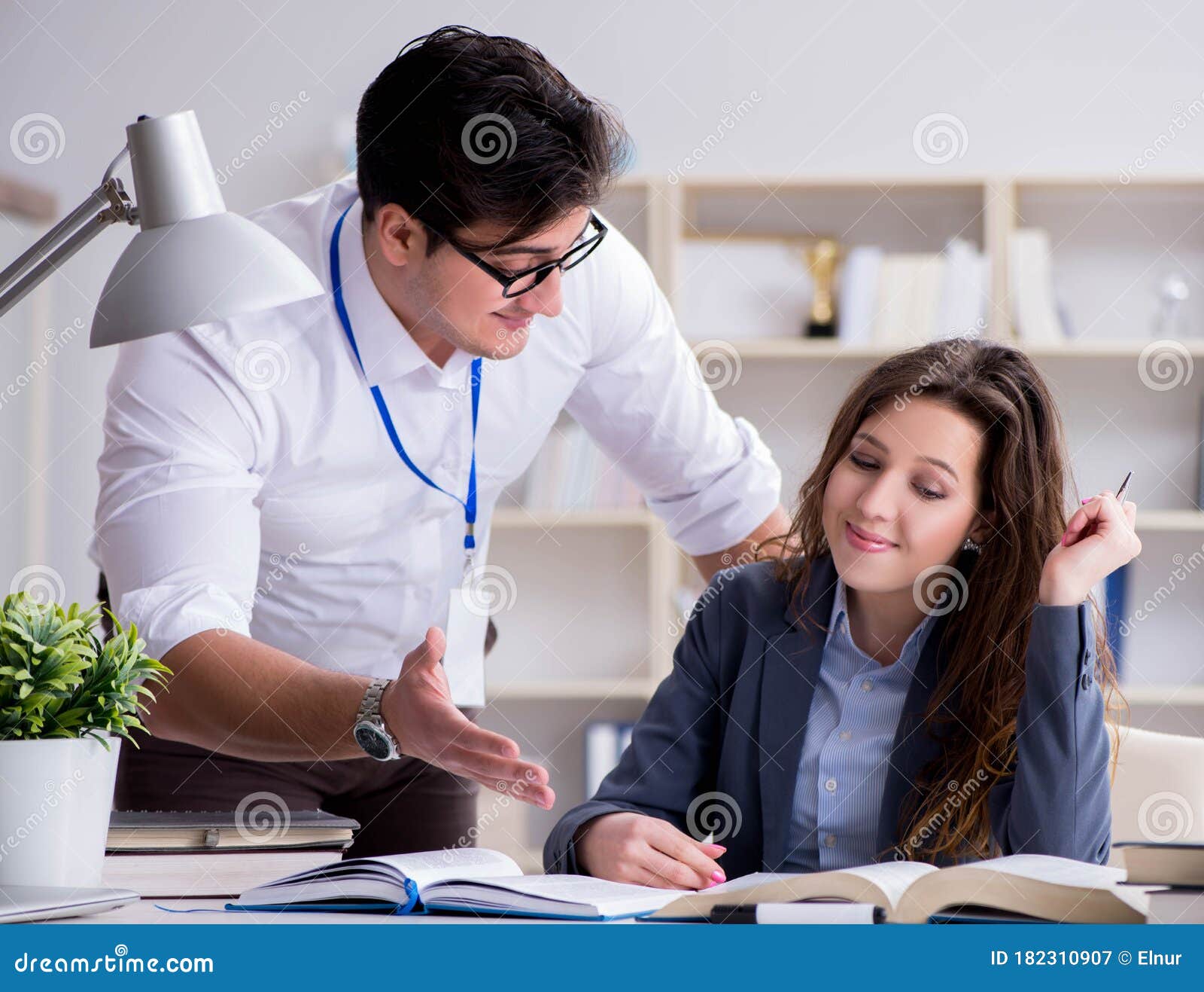 Teacher Explaining To Student at Lecture Stock Image - Image of ...