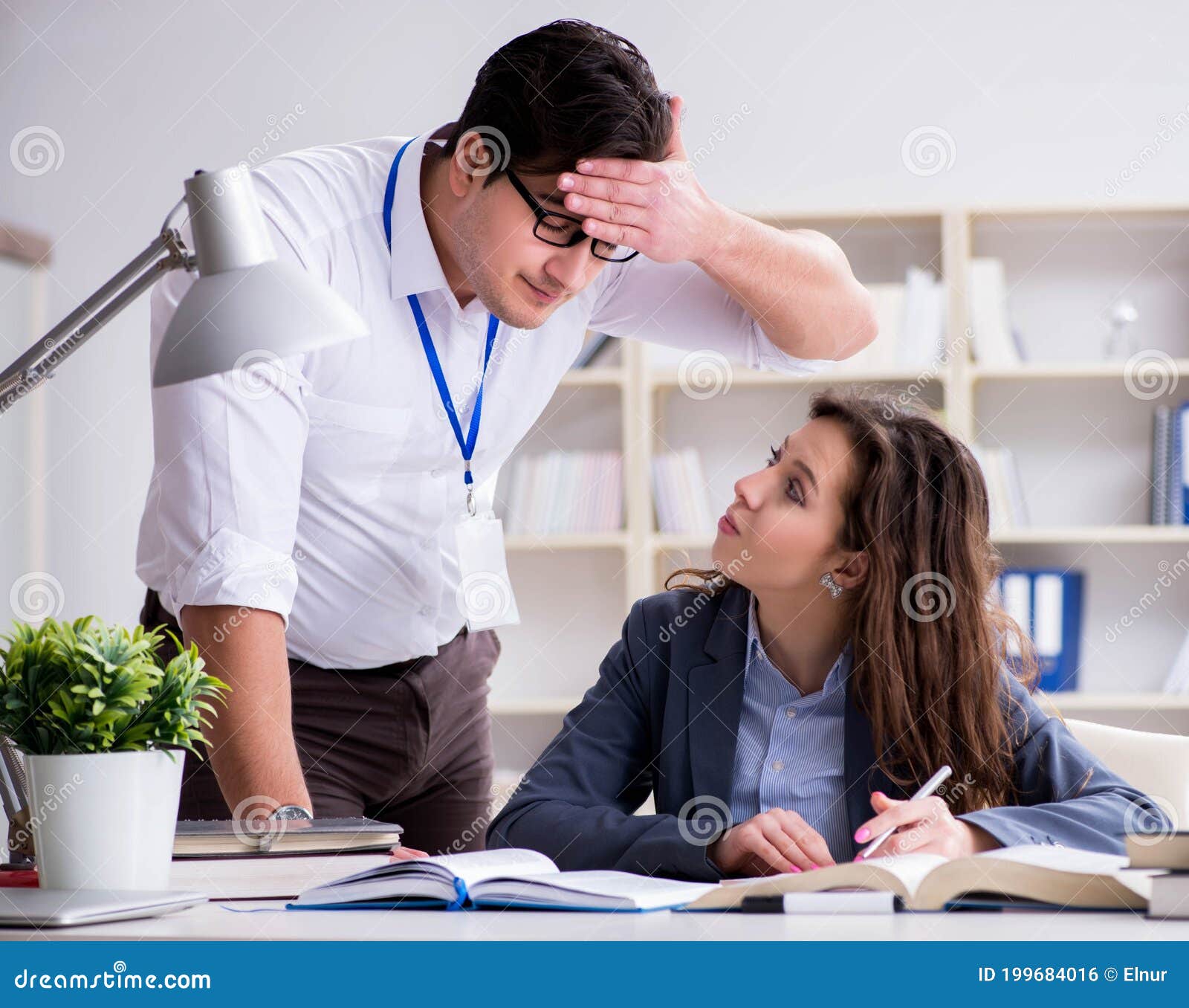 Teacher Explaining To Student at Lecture Stock Photo - Image of ...