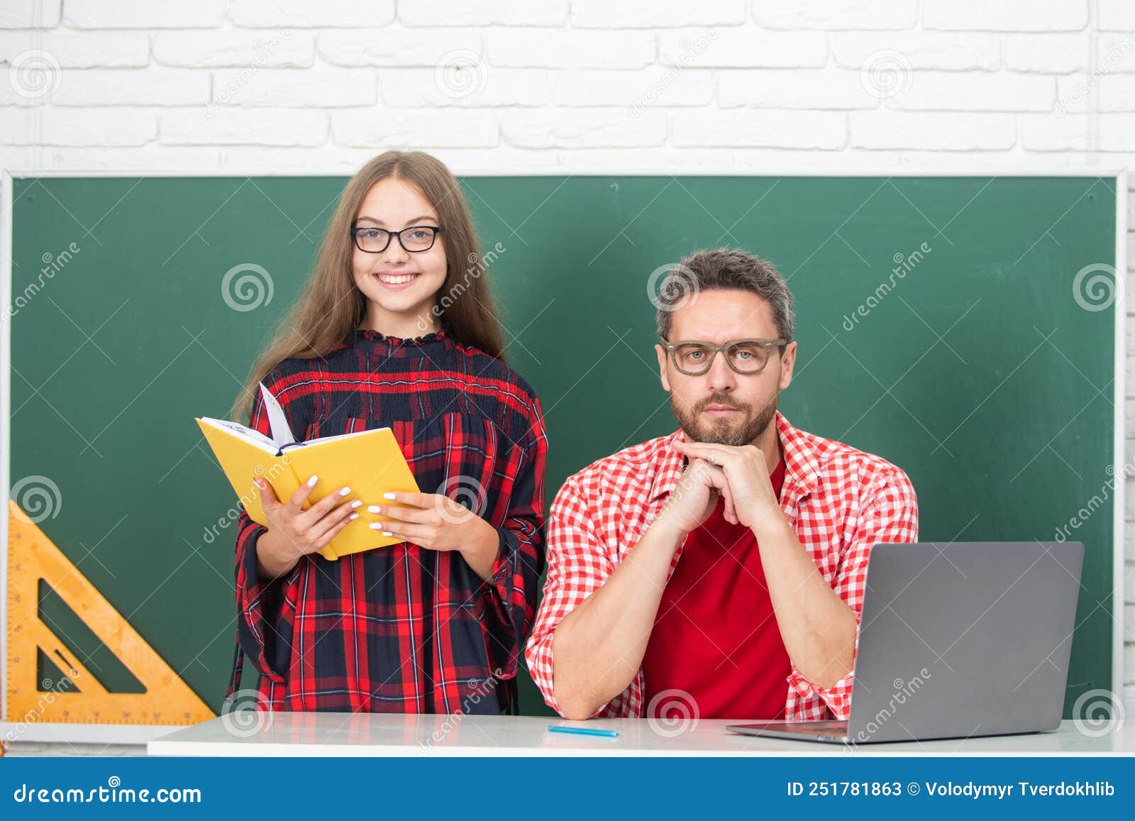 Teacher Explains Lesson To School Child. Elementary School Kids ...