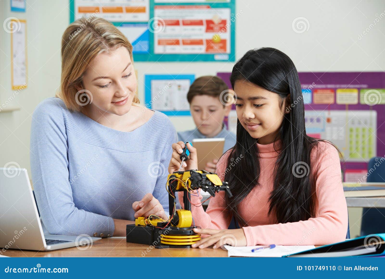 Teacher with Female Pupil in Science Lesson Studying Robotics Stock ...