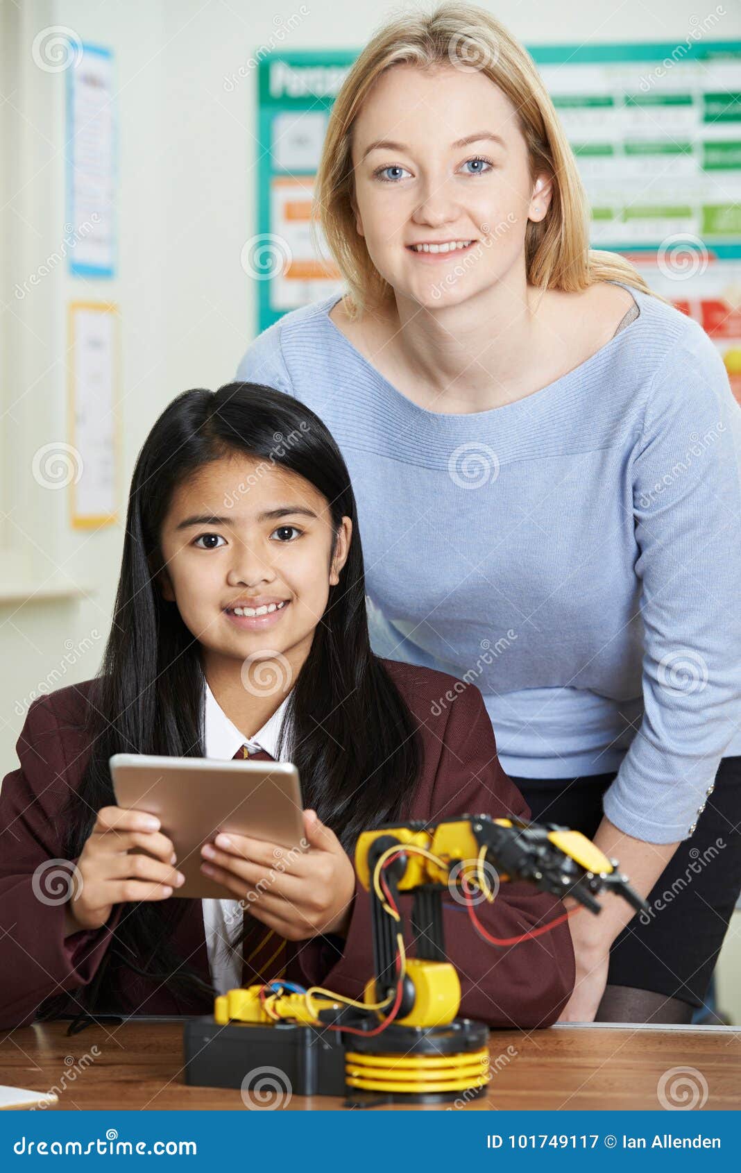 Teacher with Female Pupil in Science Lesson Studying Robotics Stock ... Teacher with Female Pupil in Science Lesson Studying Robotics Stock ...