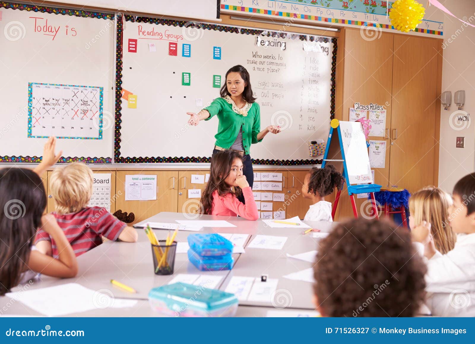 Teacher at the Front of Class with Elementary School Kids Stock Image ...