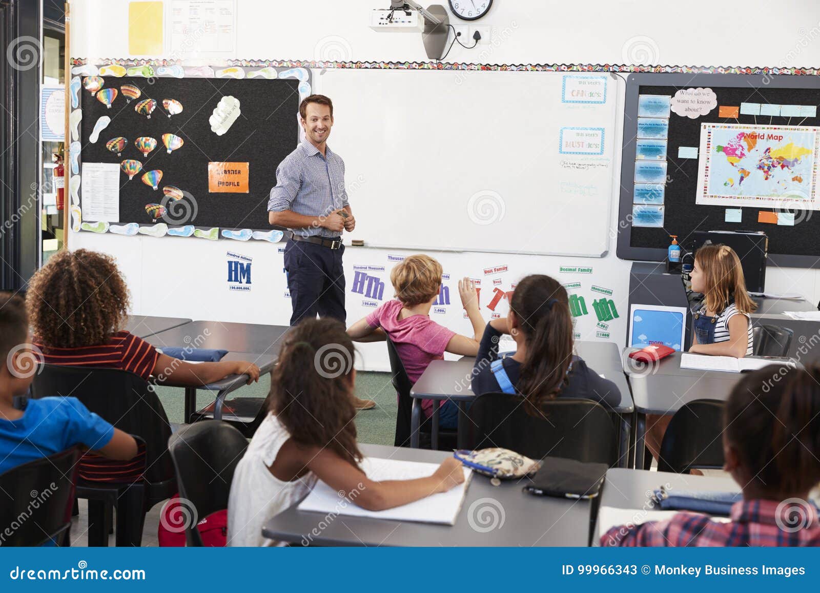 Teacher at Front of Class in an Elementary School Lesson Stock Image ...