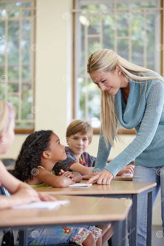 Teacher, Girl and Students in Classroom for Education, Learning and ... Teacher, Girl and Students in Classroom for Education, Learning and ...
