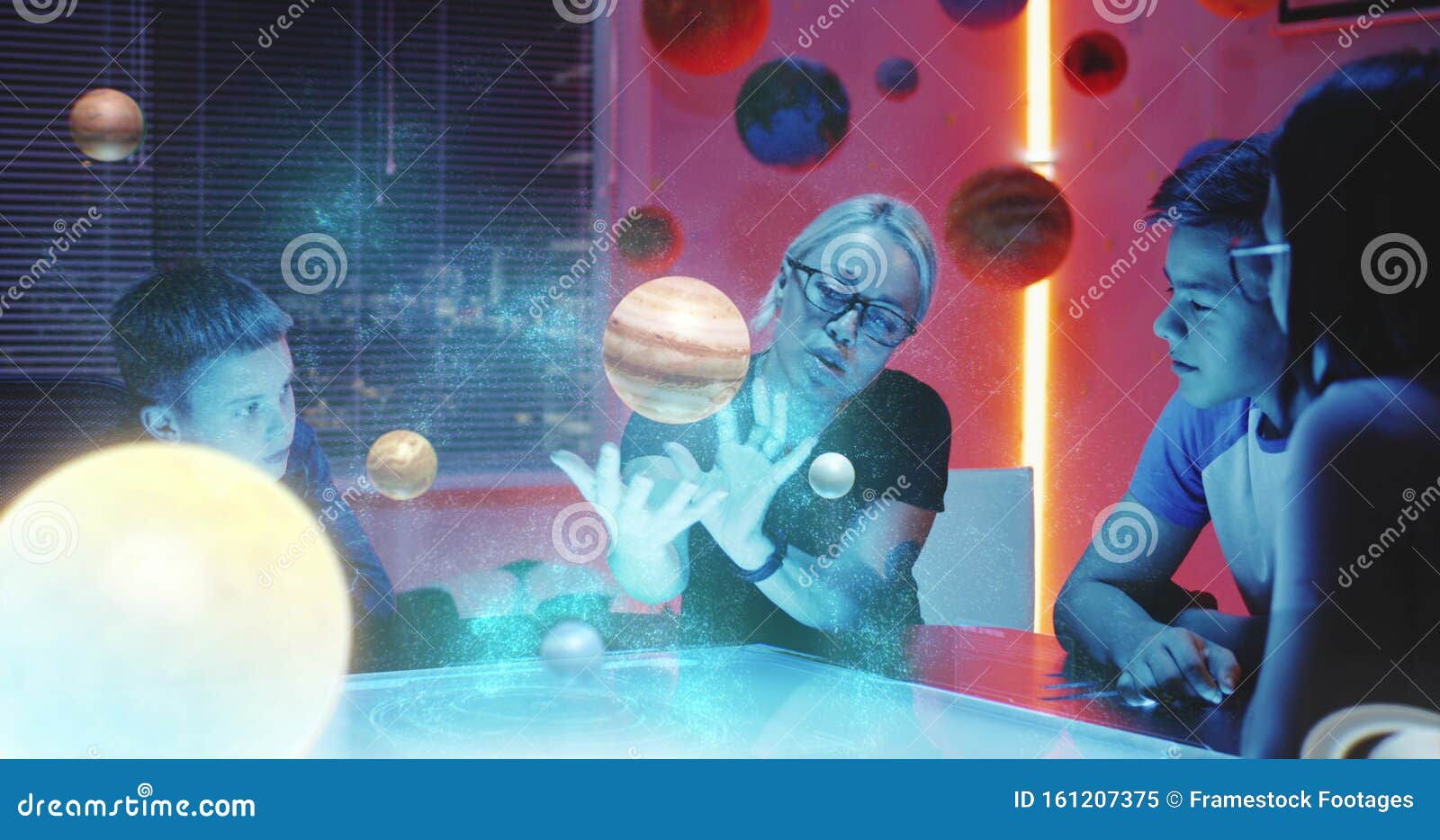 Teacher Giving a Class with Holographic Solar System Stock Image ...