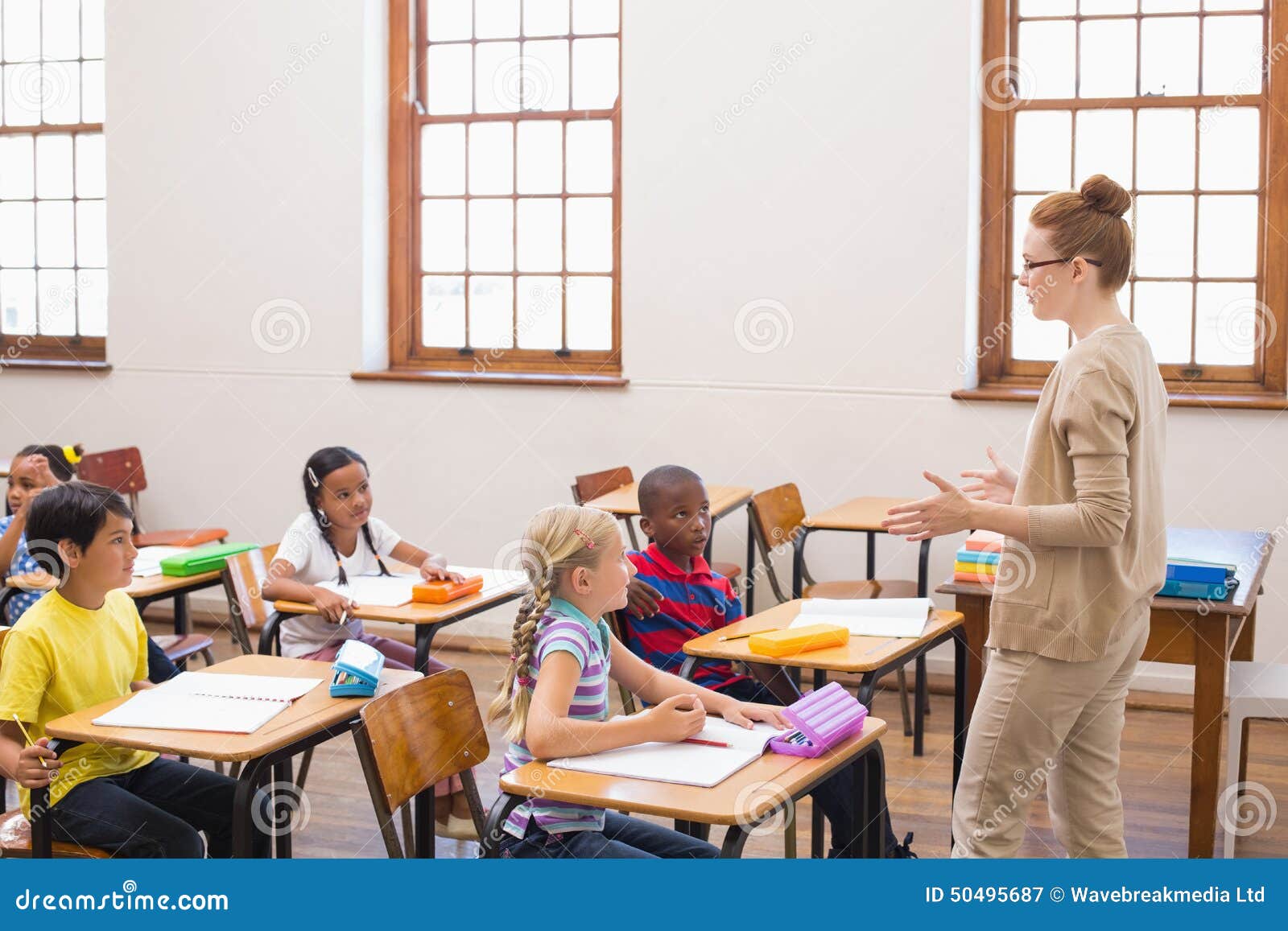 Teacher Giving a Lesson in Classroom Stock Image - Image of interacting ...